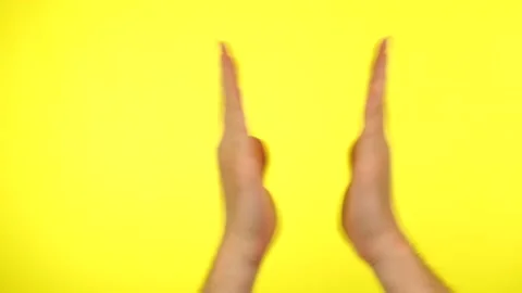Isolated applause on yellow background | Stock Video | Pond5