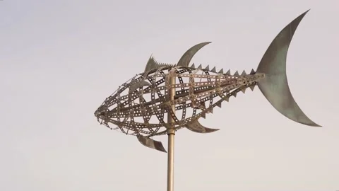 Isolated tuna shaped weather vane moving... | Stock Video | Pond5