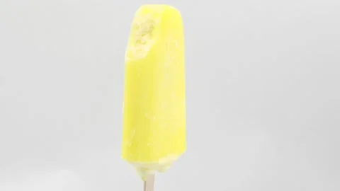 An Isolated Yellow Ice-Cream Lolly Rotat... | Stock Video | Pond5