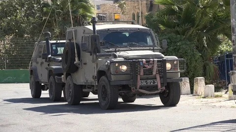 Israeli army jeeps on streets Hebron set... | Stock Video | Pond5