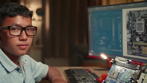 It Asian Boy Is Working With Desktop Com... | Stock Video | Pond5