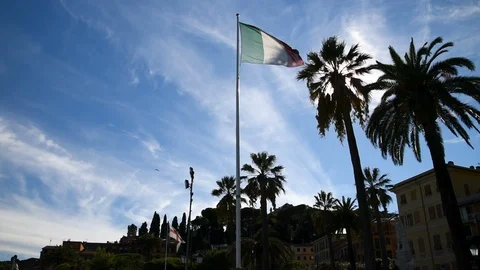Italian flag flapping in blue sky | Stock Video | Pond5