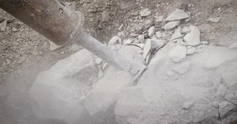 Jackhammer digging up sidewalk rocks | Stock Video | Pond5