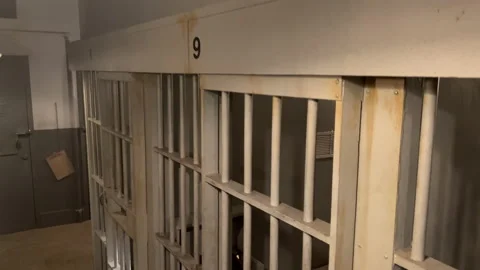 Jail prison cell hall jib down | Stock Video | Pond5