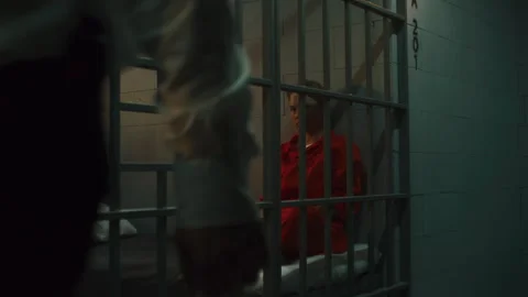 Jailer gives phone to female prisoner th... | Stock Video | Pond5