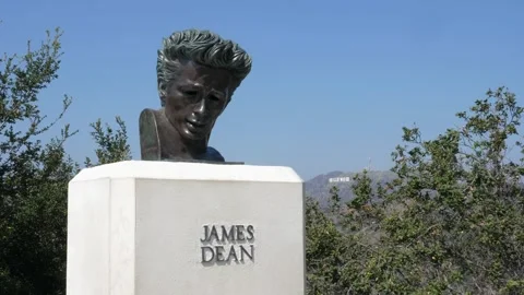 James Dean sculpture with Hollywood sign... | Stock Video | Pond5