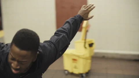 Janitor dancer moves to music on subway ... | Stock Video | Pond5