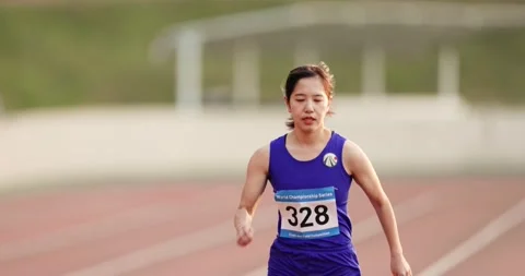 Japanese athlete running on track | Stock Video | Pond5