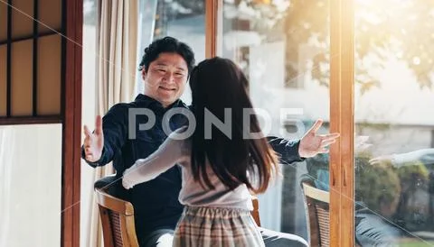 Photograph: Japanese, father and hug child at house with love, care and ...