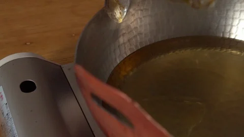 a Japanese female chef pouring oil for J... | Stock Video | Pond5
