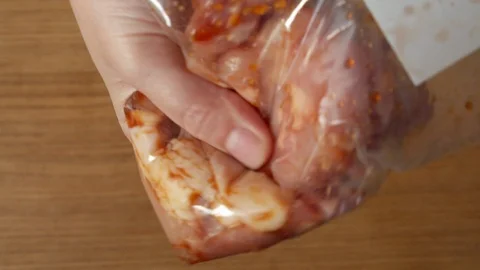 a Japanese female chef seasoning chicken... | Stock Video | Pond5