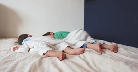 Japanese kids sleeping in bed | Stock Video | Pond5