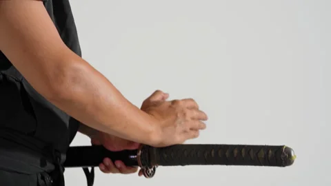 A Japanese man pulls out a katana from a... | Stock Video | Pond5