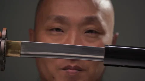 Japanese man, samurai, holds in his hand... | Stock Video | Pond5