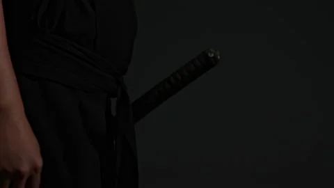 Japanese man, samurai, holds in his hand... | Stock Video | Pond5