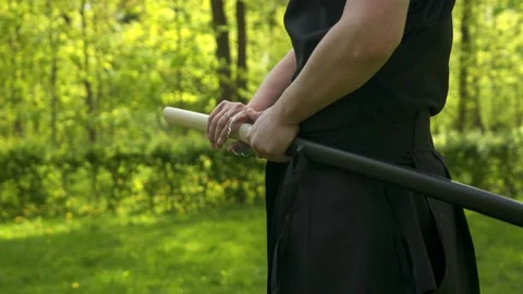 Japanese man, samurai, holds in his hand... | Stock Video | Pond5