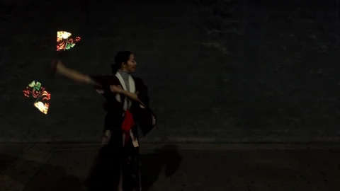 Japanese Woman Spinning Visual LED Staff... | Stock Video | Pond5