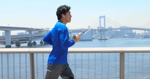 Japanese young man running on a sunny da... | Stock Video | Pond5