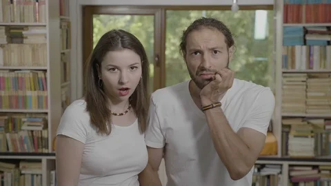 Jaw dropping reaction from teenage coupl... | Stock Video | Pond5