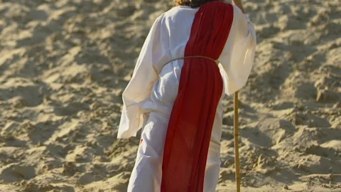 Jesus Christ in robe and red sash walkin... | Stock Video | Pond5