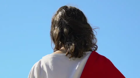 Jesus Christ in robe holding cross and r... | Stock Video | Pond5