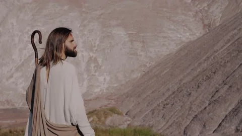 Jesus Christ with a staff in robe is sta... | Stock Video | Pond5