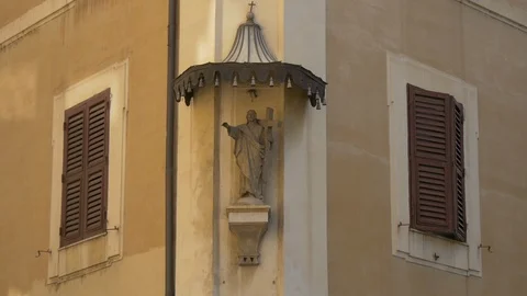 Jesus Christ statue on a corner | Stock Video | Pond5
