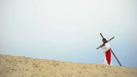 Jesus falling under heavy wooden cross, ... | Stock Video | Pond5