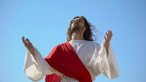 Jesus raising hands to sky and praying, ... | Stock Video | Pond5