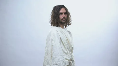Jesus turning to camera on shiny backgro... | Stock Video | Pond5