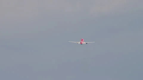 Jet airplane fly away, back view | Stock Video | Pond5