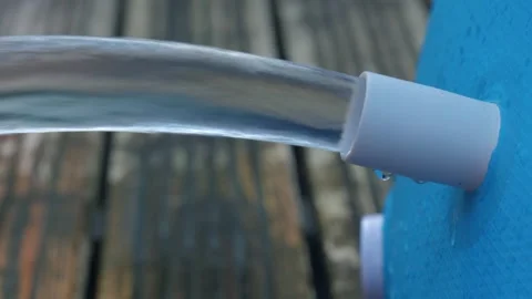 Jet of water flows out of a blue swimmin... | Stock Video | Pond5