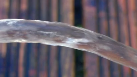 Jet of water flows out of a blue swimmin... | Stock Video | Pond5