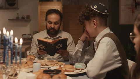 Jewish Dad in Kippah Reading Torah to Te... | Stock Video | Pond5