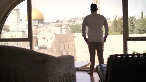 Jewish man standing by the window, looki... | Stock Video | Pond5
