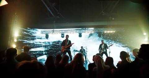 Jib shot of a rock band playing the gig ... | Stock Video | Pond5