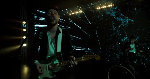 Jib shot of a rock band playing the gig ... | Stock Video | Pond5