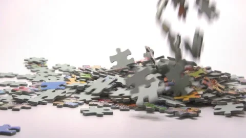 Jigsaw Puzzle Pieces Falling Against Whi... | Stock Video | Pond5