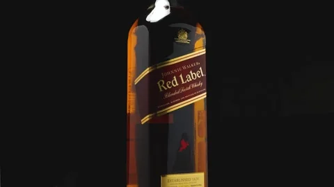 Johnnie Walker Red Label bottle on a dar... | Stock Video | Pond5