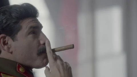 Joseph Stalin smoking a cigar at Tehran ... | Stock Video | Pond5