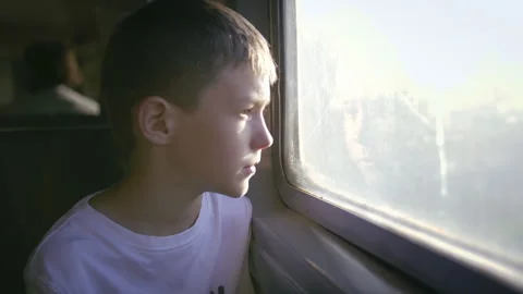 Journey of Solitude: Sad Boy Riding the ... | Stock Video | Pond5