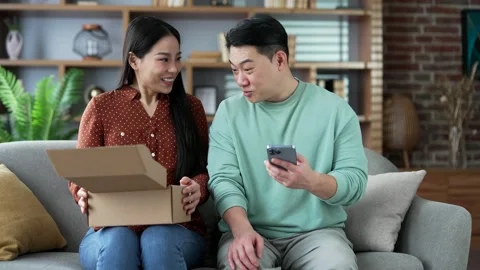 Joyful asian family couple customer open... | Stock Video | Pond5