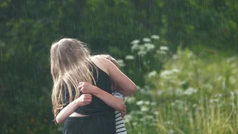 Two People Hugging In The Rain