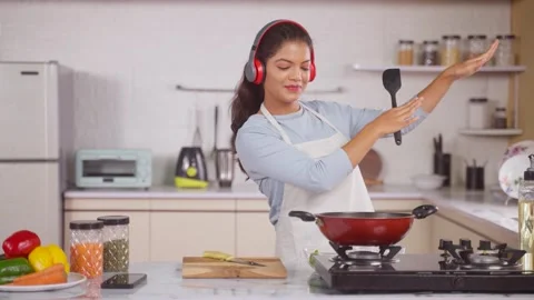 Joyful Dancing Indian woman cooking by l... | Stock Video | Pond5