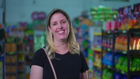 Joyful female consumer standing inside s... | Stock Video | Pond5