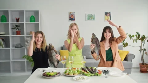 joyful girlfriends dancing with fish in ... | Stock Video | Pond5