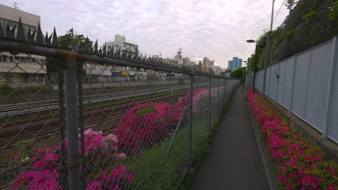 JR railroad track runs along pedestrian ... | Stock Video | Pond5