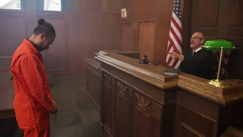 Judge and defendant talking at the bench... | Stock Video | Pond5