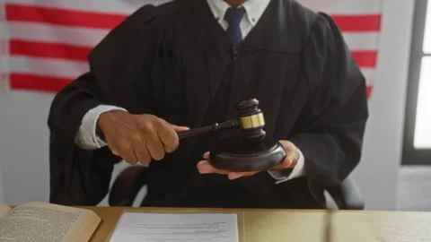 Judge holding gavel in courtroom with am... | Stock Video | Pond5