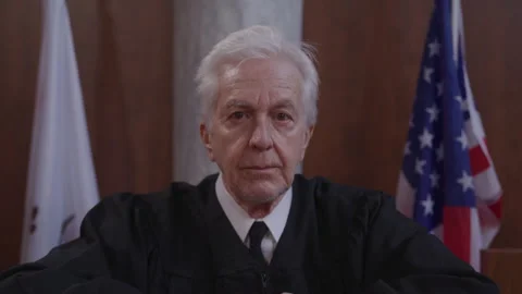 Judge Looks at the Camera While Sitting ... | Stock Video | Pond5